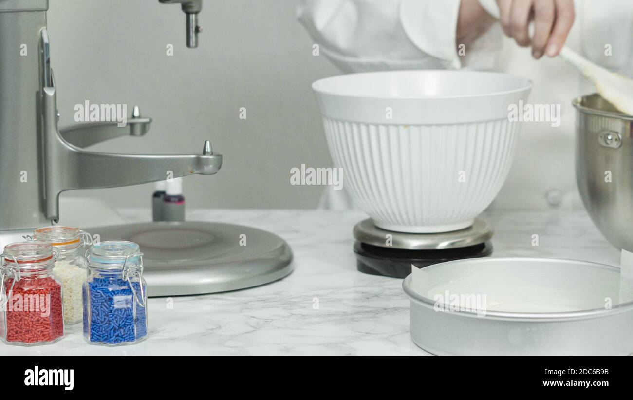 Step by step. Measuring cake batter with a digital kitchen scale to ...