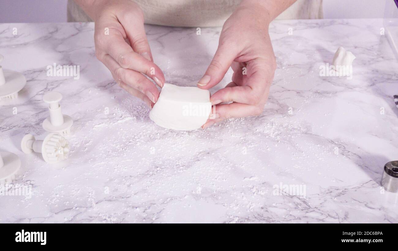 Step by step. Cutting out snowflakes with cookie cutters out of white ...