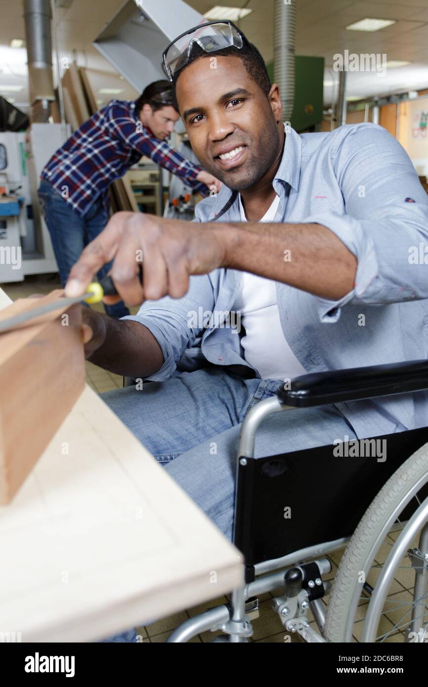 portrait of disabled male carpenter at work Stock Photo - Alamy