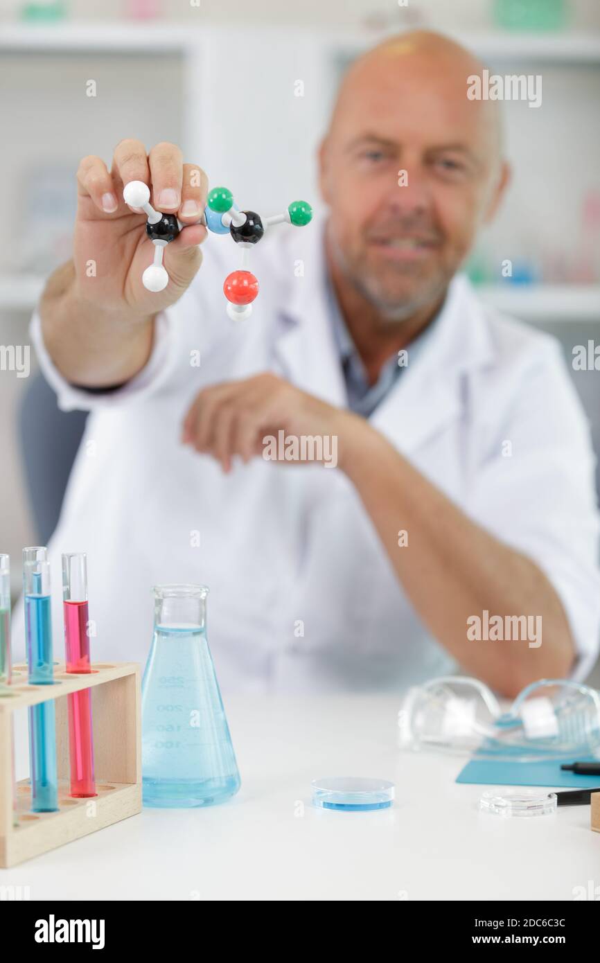 scientist man holding molecule on his hand Stock Photo - Alamy