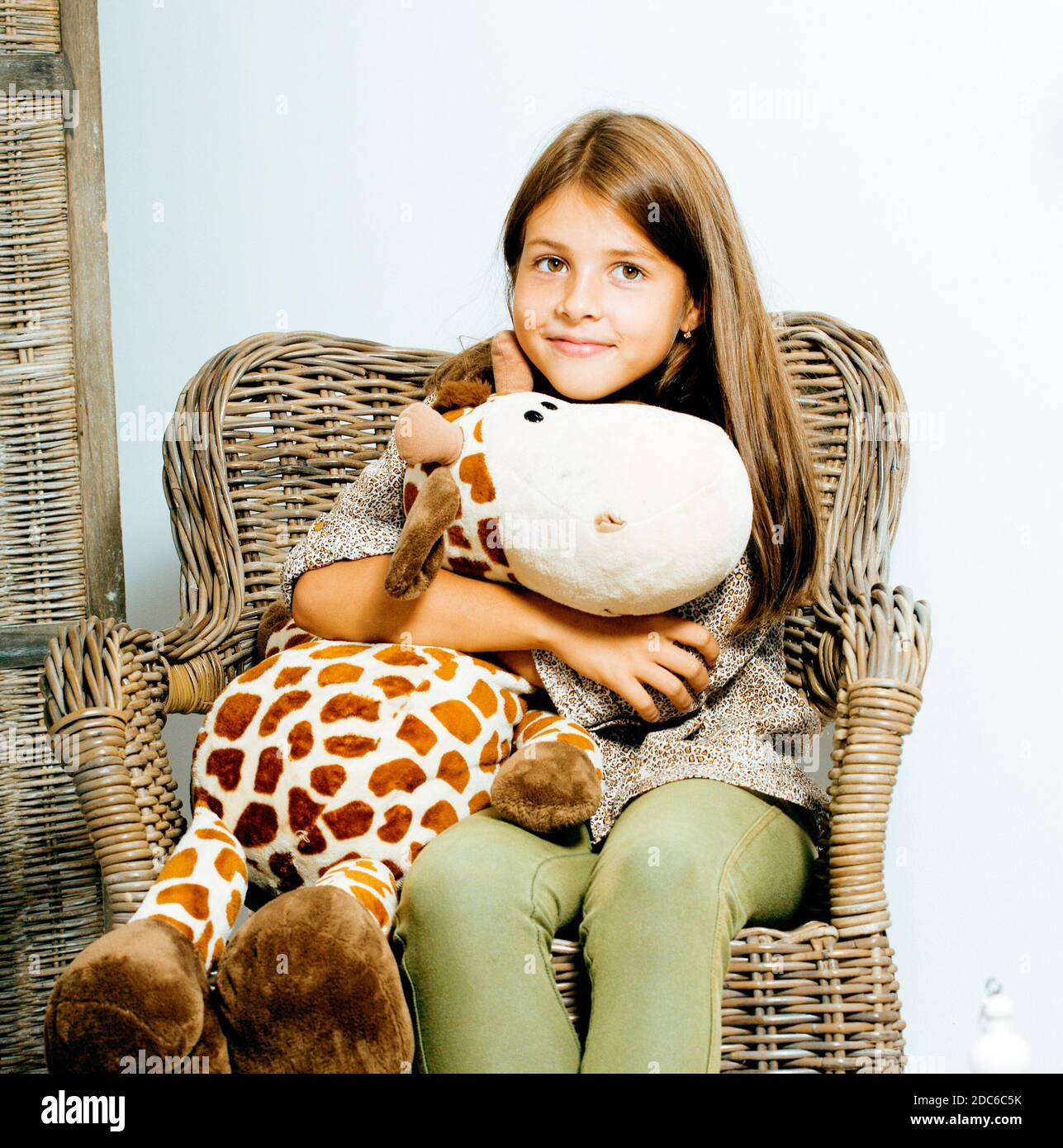 little cute brunette girl at home interior happy smiling close up ...