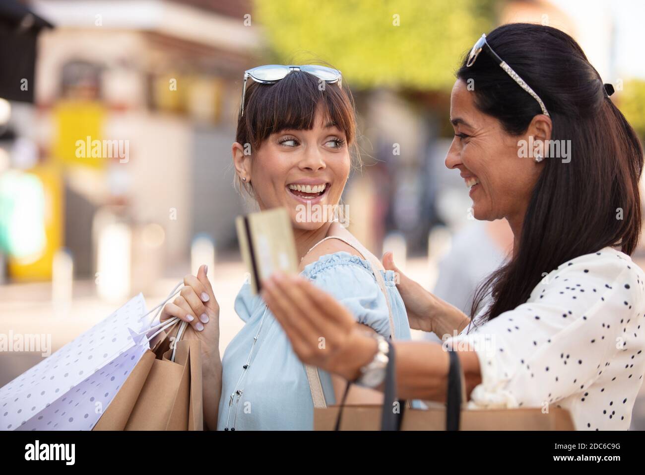 happy friends shopping two beautiful young women enjoying shopp Stock ...
