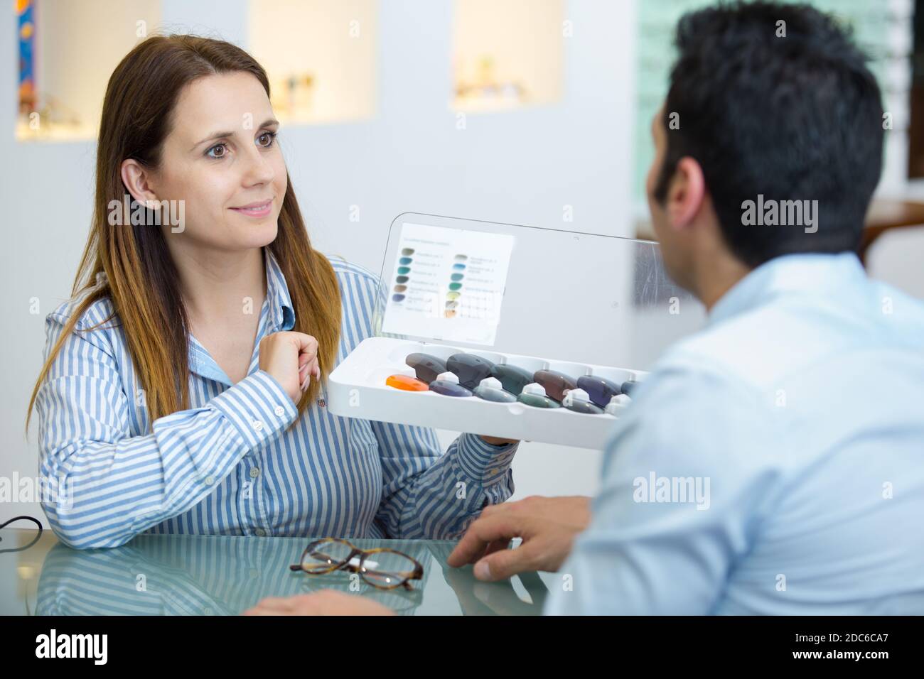choosing sun lens at optics store Stock Photo - Alamy