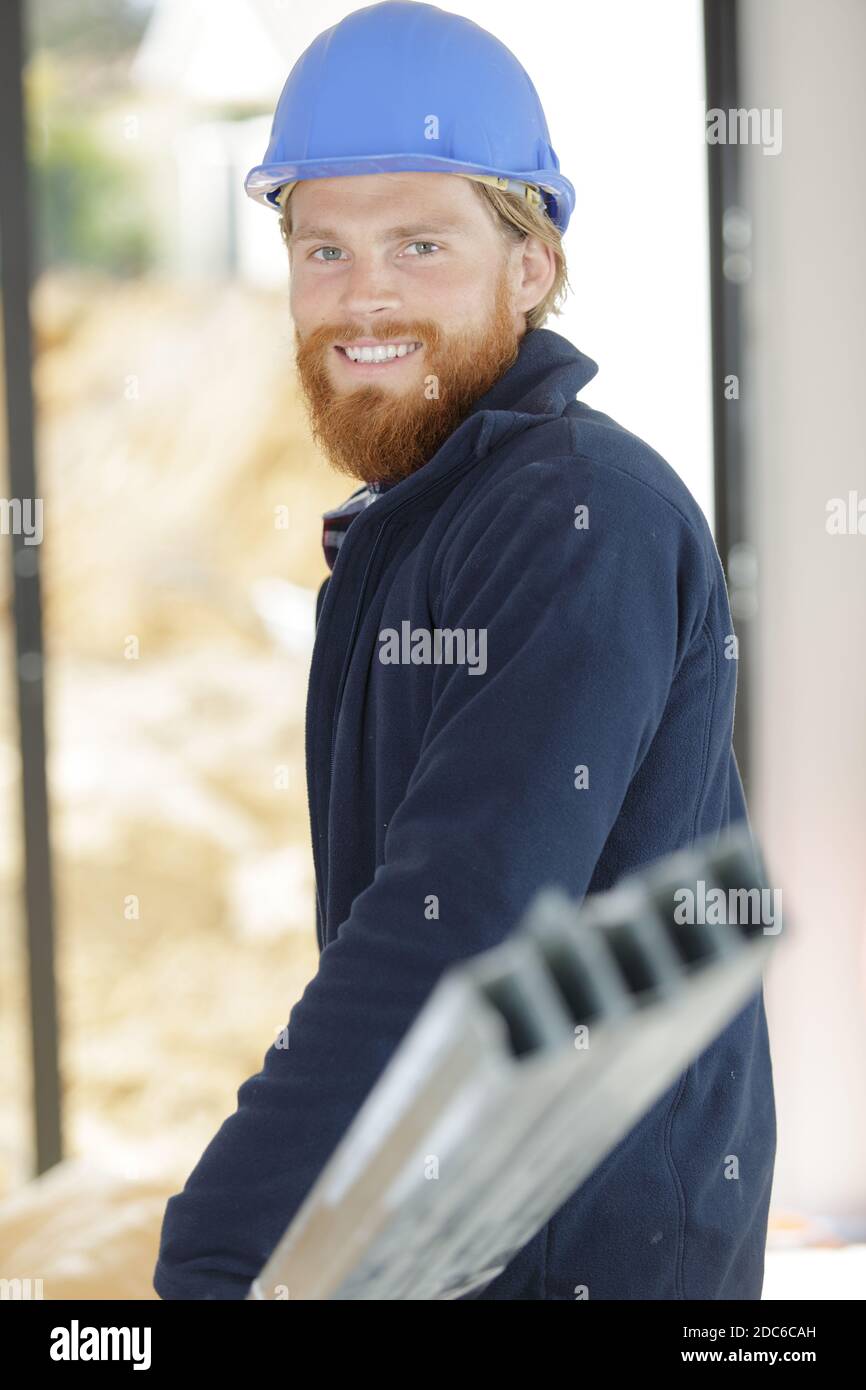 Man carrying girder hi-res stock photography and images - Alamy
