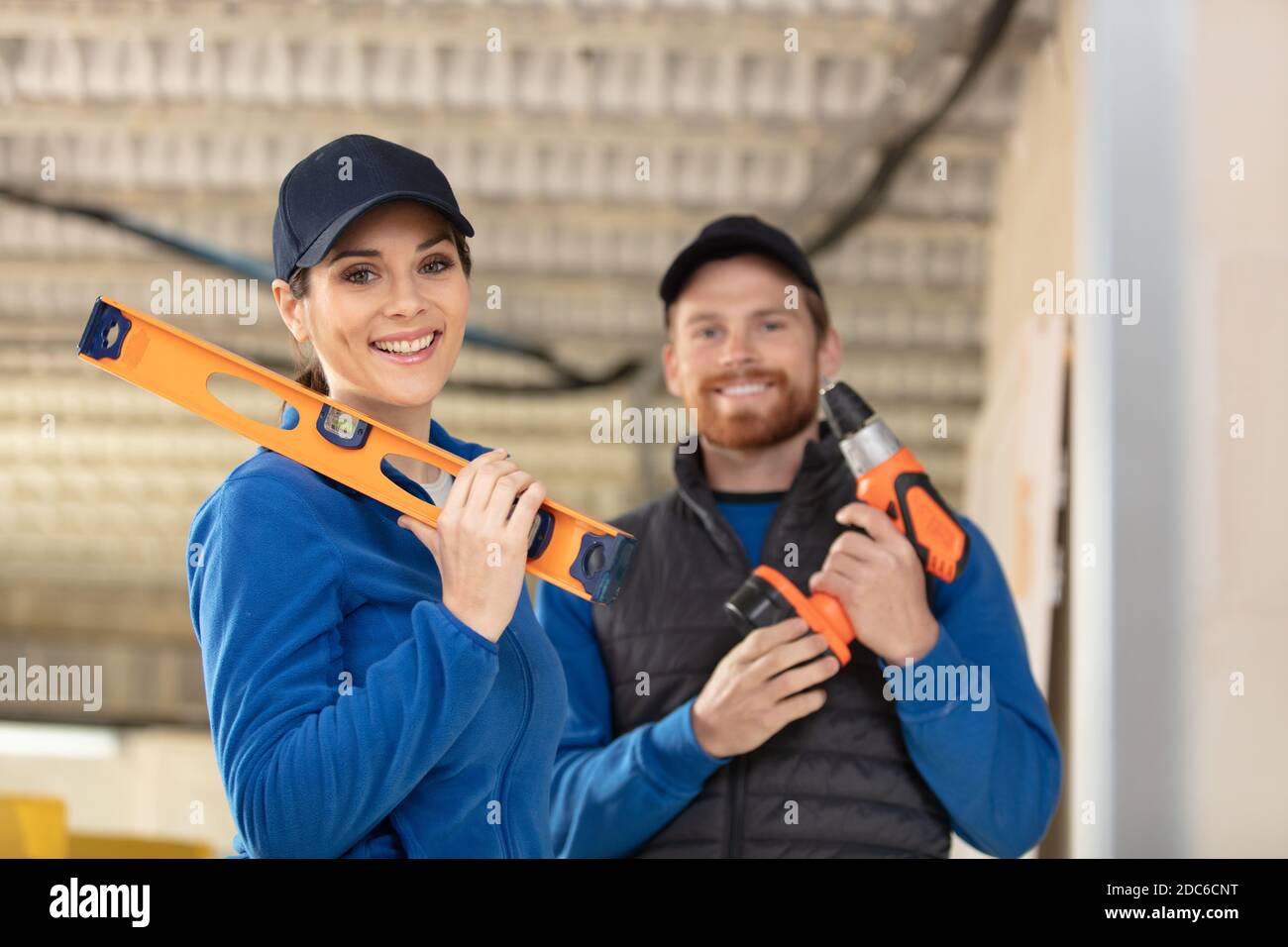 builder and female apprentice on site Stock Photo - Alamy
