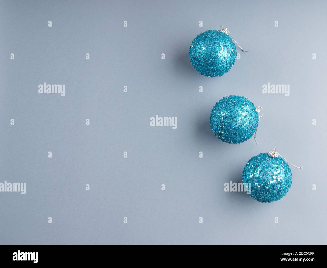 Christmas minimal festive blue bauble background Stock Photo - Alamy