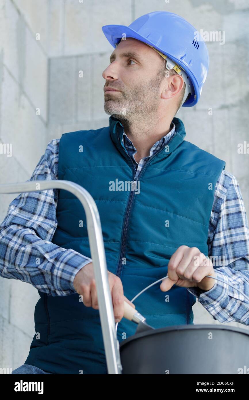 man on ladder during house improvement Stock Photo - Alamy