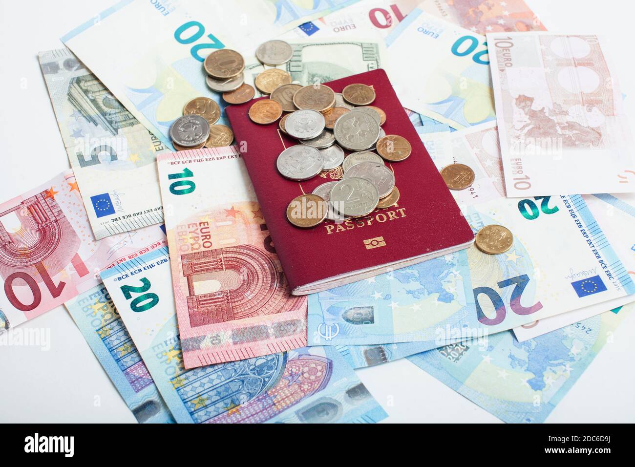 Cash on table isolated: dollars, euro, rubl broken money. All in mess ...