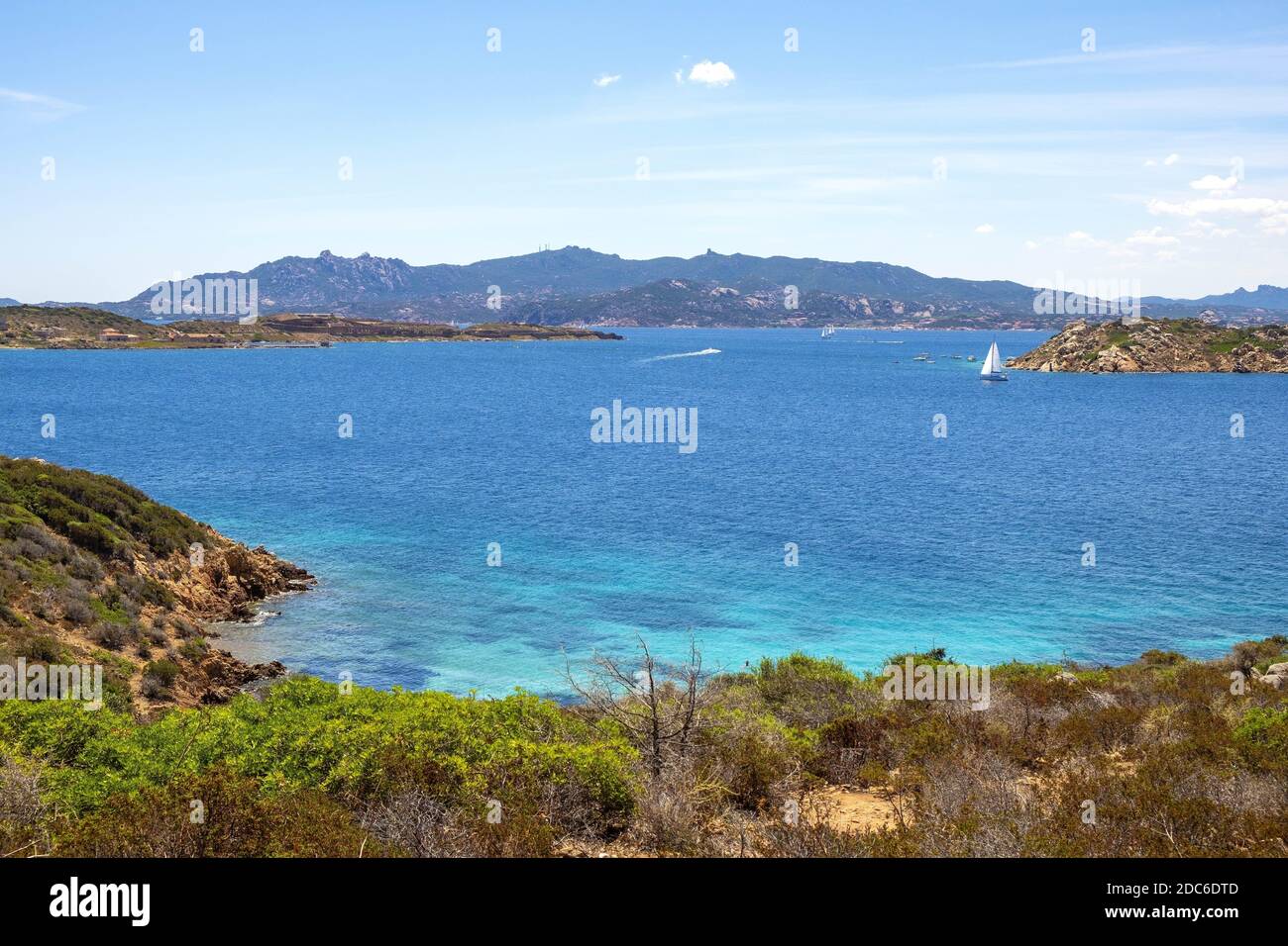 Panoramic view of Caprera Island and Spiaggia di Cala Portese harbor at ...