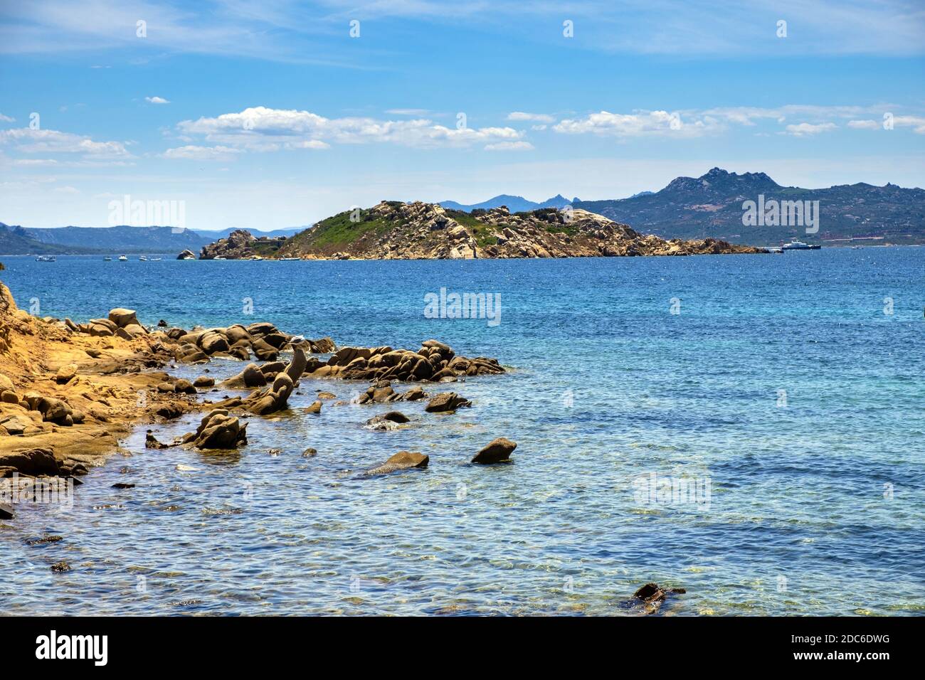 Panoramic view of Caprera Island and Spiaggia di Cala Portese harbor at ...