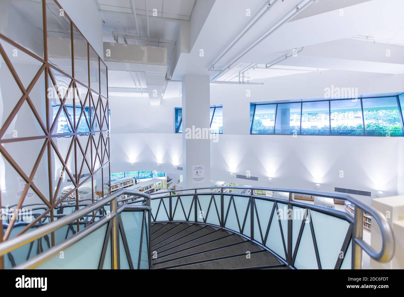 Interior of library that have a gentle flight of staircase for all ages ...