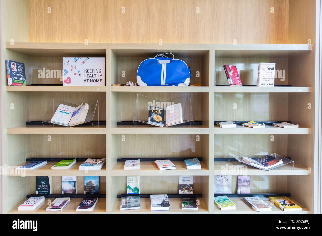 Public library bookshelf display with recommended books for the public ...