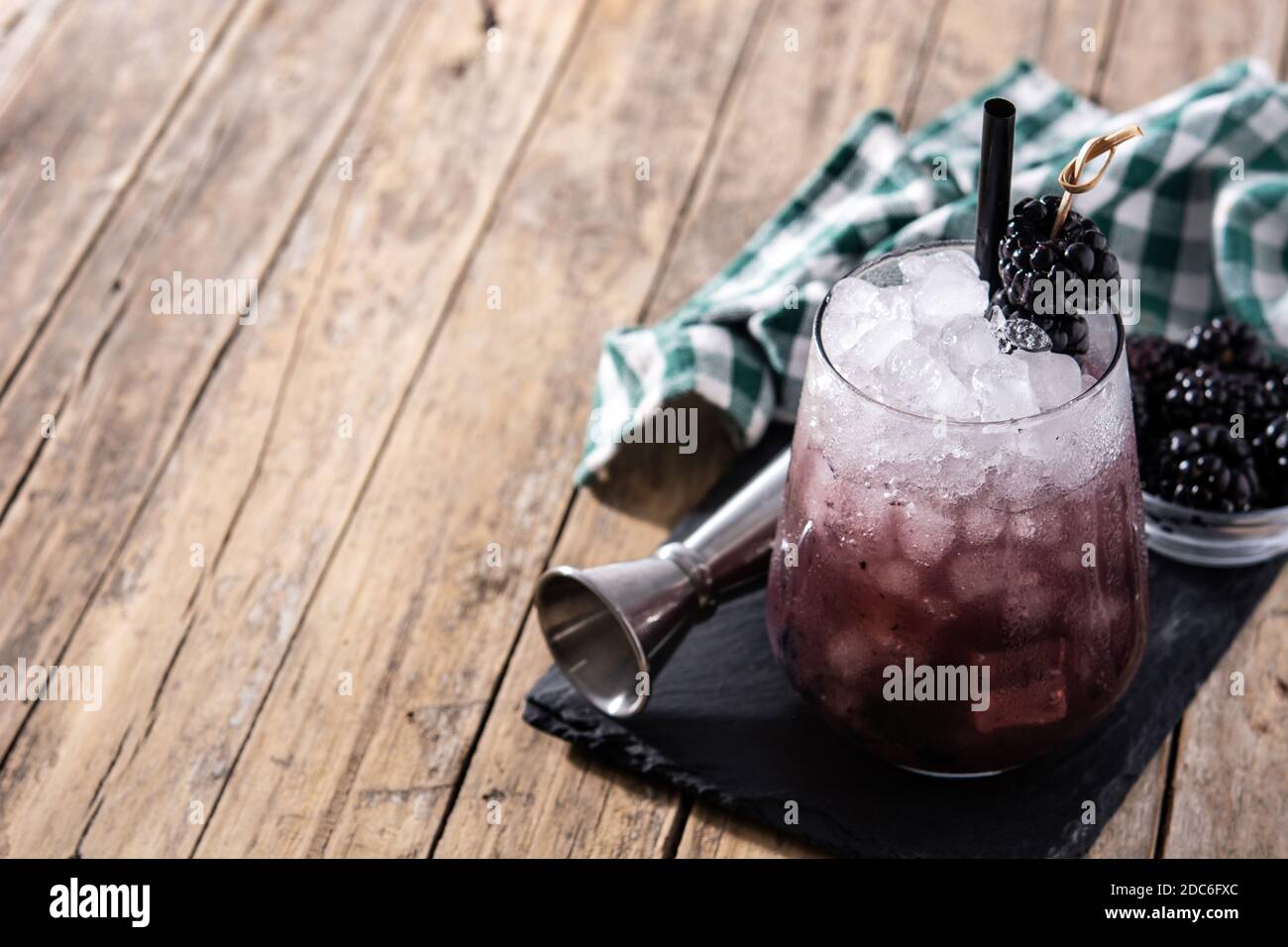 Fresh blackberry cocktail in cold glass on wooden table Stock Photo - Alamy