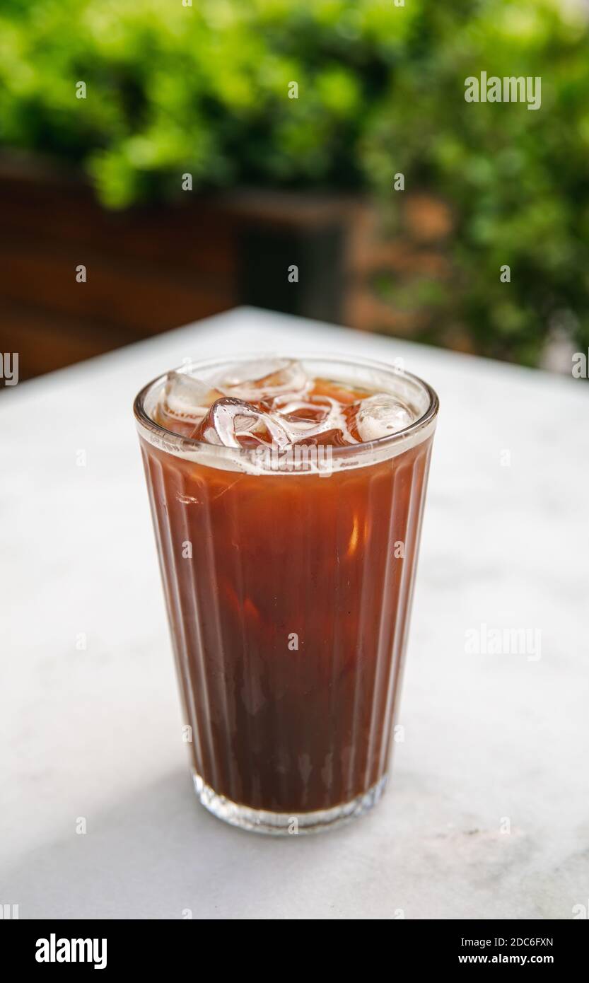 A glass of cold brew ice coffee. Cold brewed iced coffee with ice cubes ...