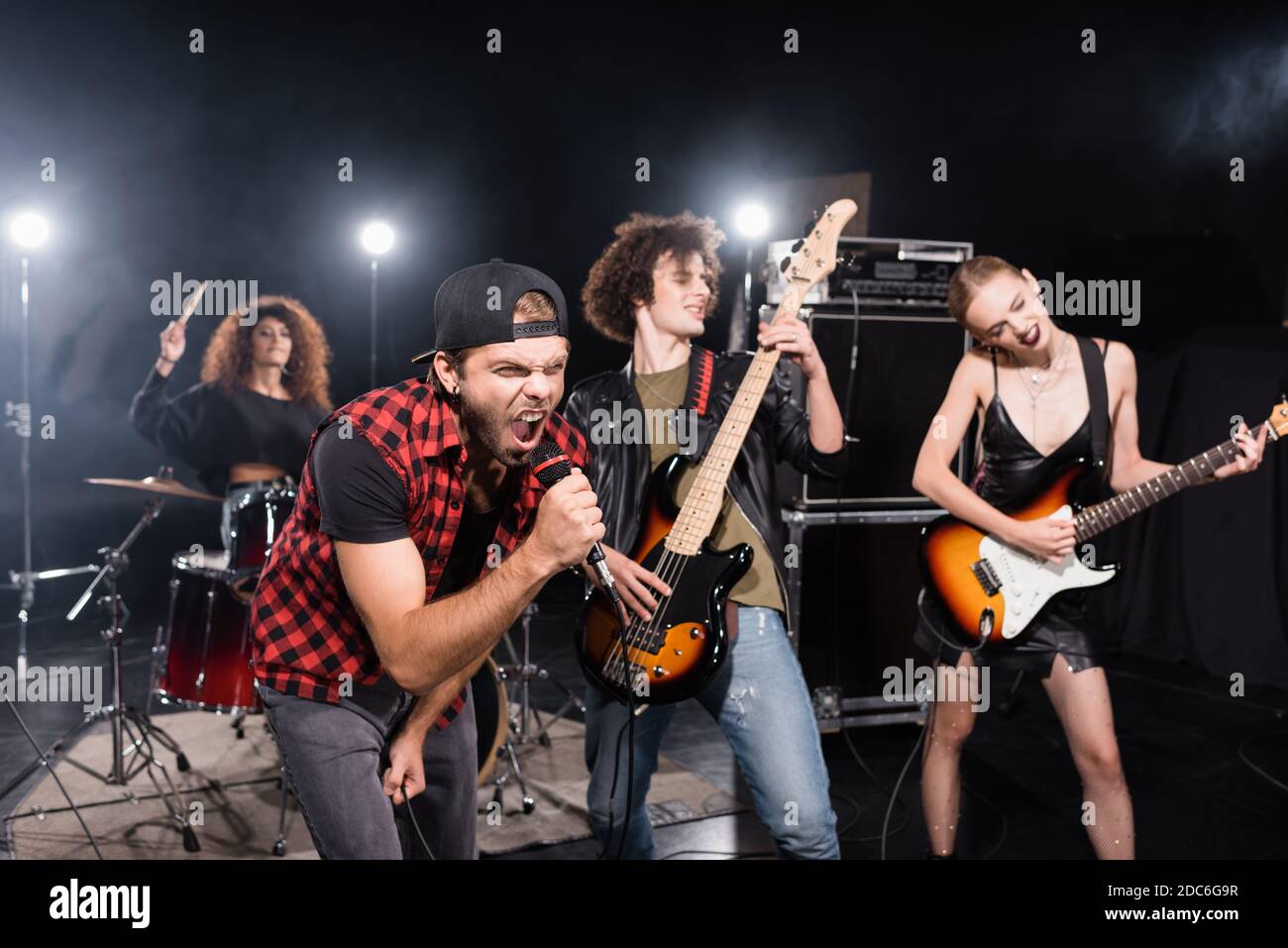 Female vocalist leaning microphone drummer hi-res stock photography and ...