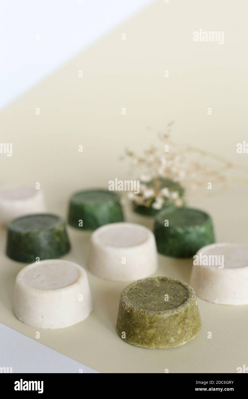 Many bars of natural herbal colored soaps in light background Stock ...