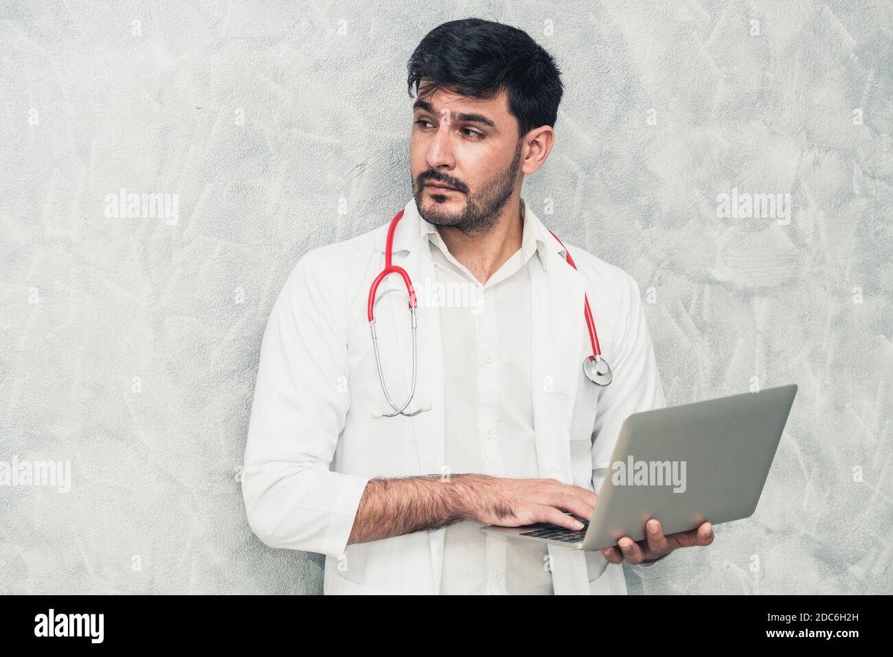Doctor using laptop computer at the hospital. Medical healthcare and ...