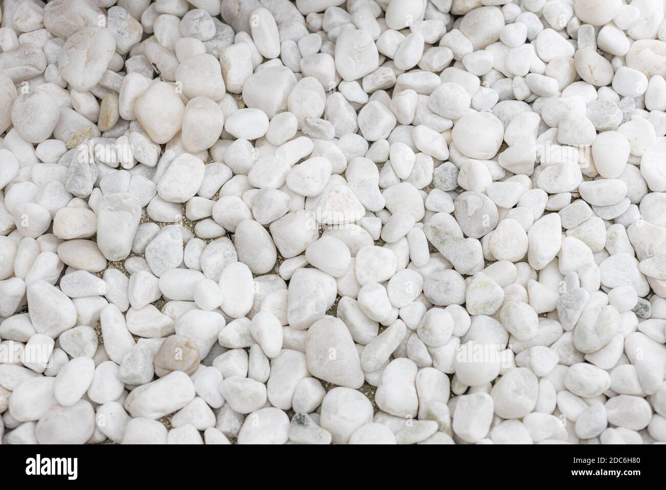 White pebbles stone texture and background Stock Photo - Alamy
