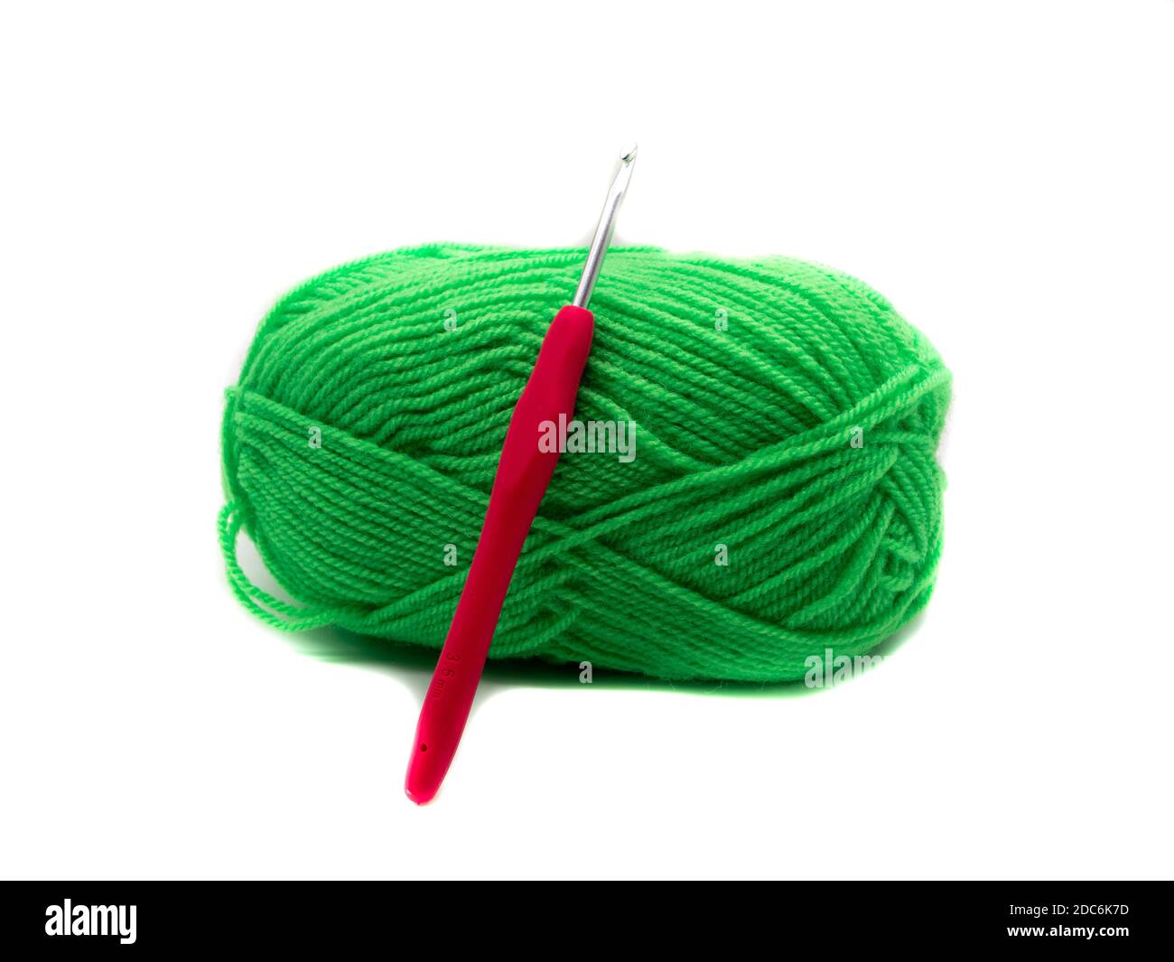 Green ball of wool with a crochet hook Stock Photo - Alamy