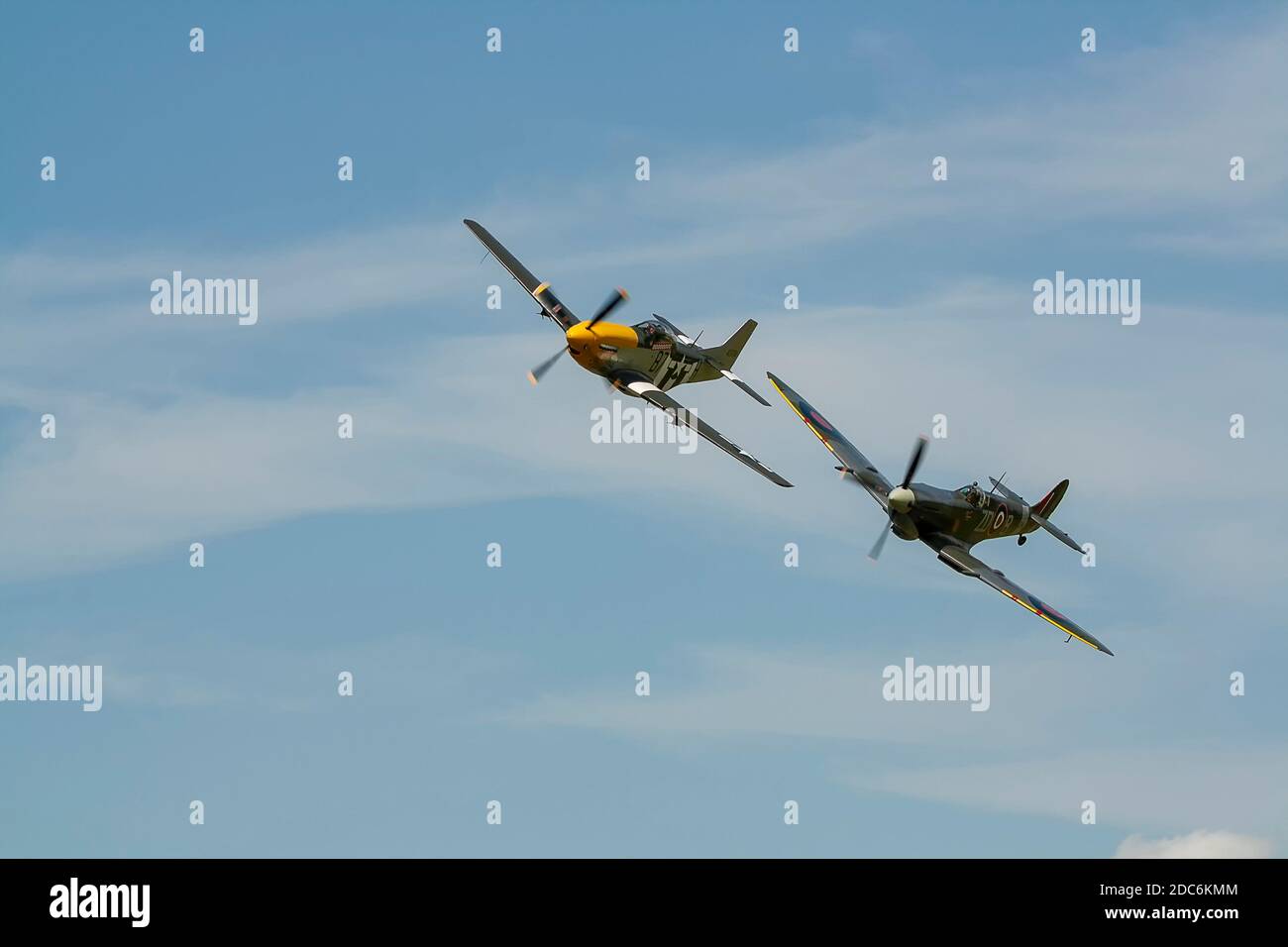 A Supermarine Spitfire and North American P-51 Mustang flying in tandem ...