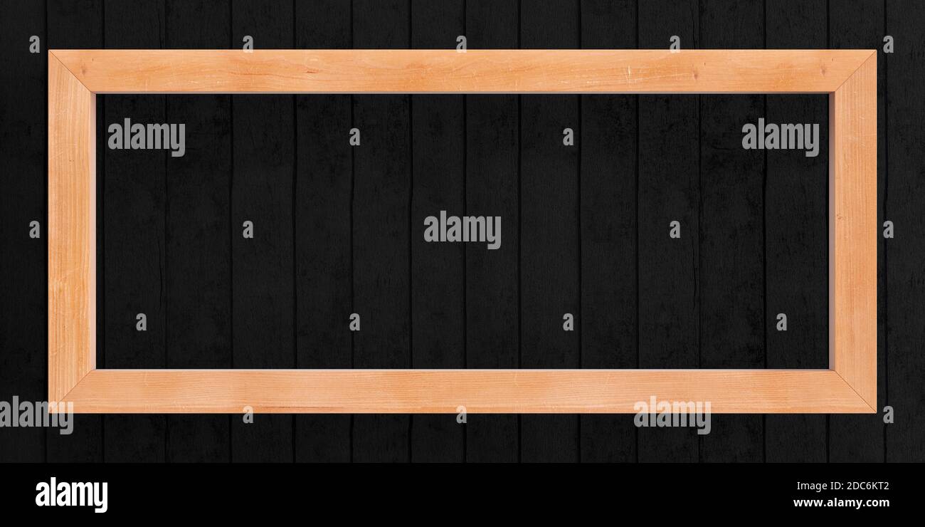 Picture of natural wood slats on a background of matte black boards ...