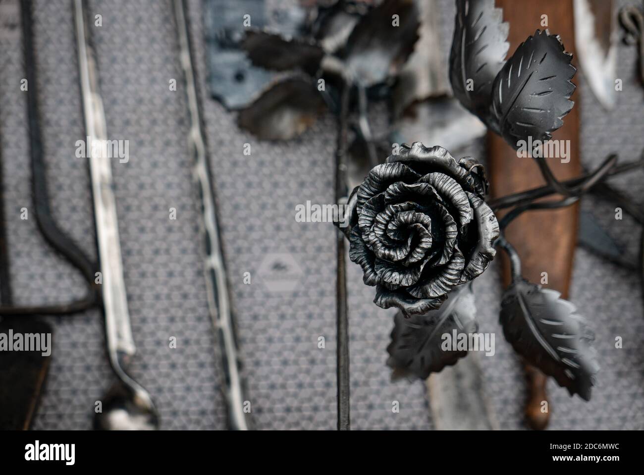 Metal rose made by a blacksmith over gray background Stock Photo - Alamy