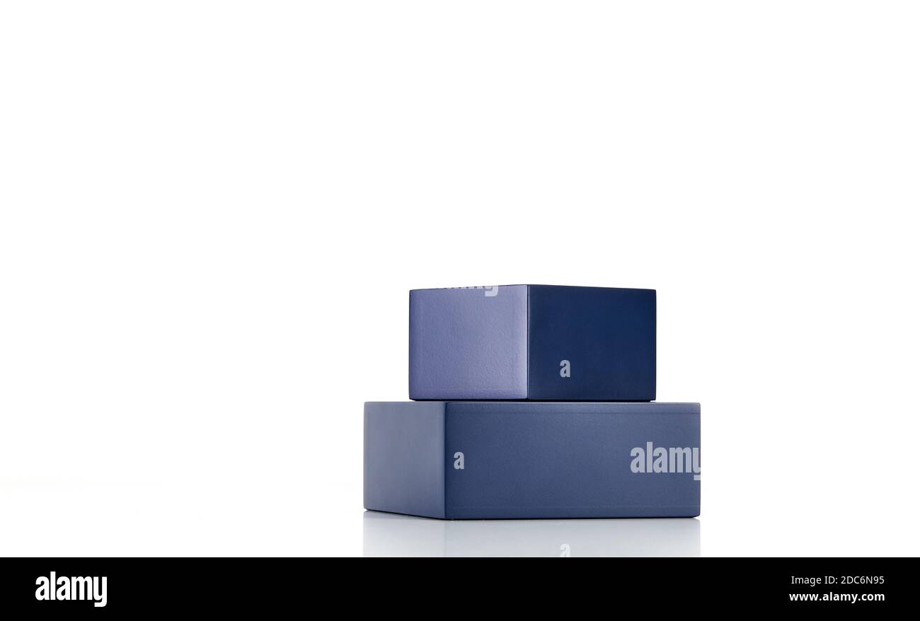 A closeup shot of different size cubes on white background Stock Photo ...