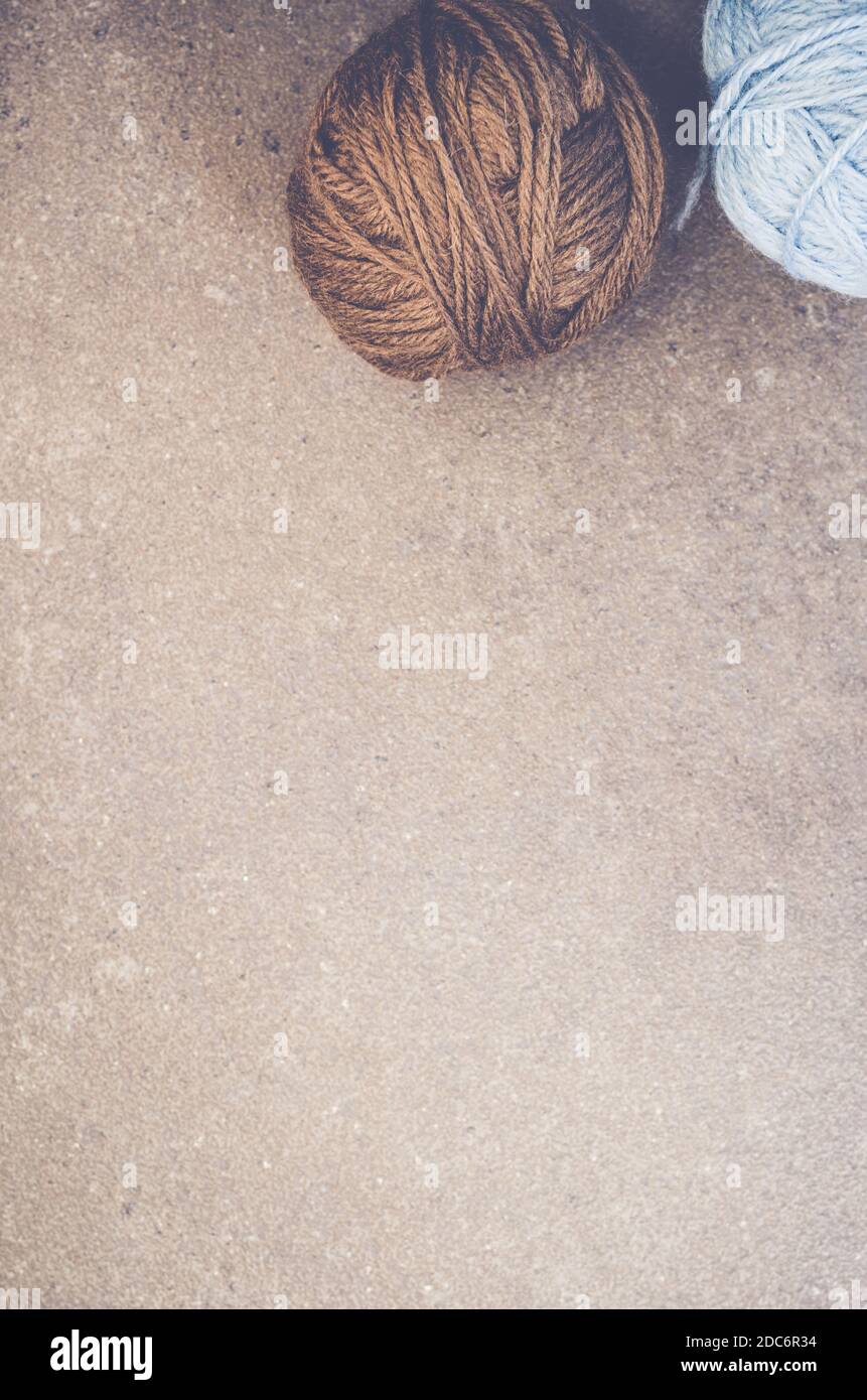 A vertical shot of balls of yarn on a rough surface - copy space Stock ...