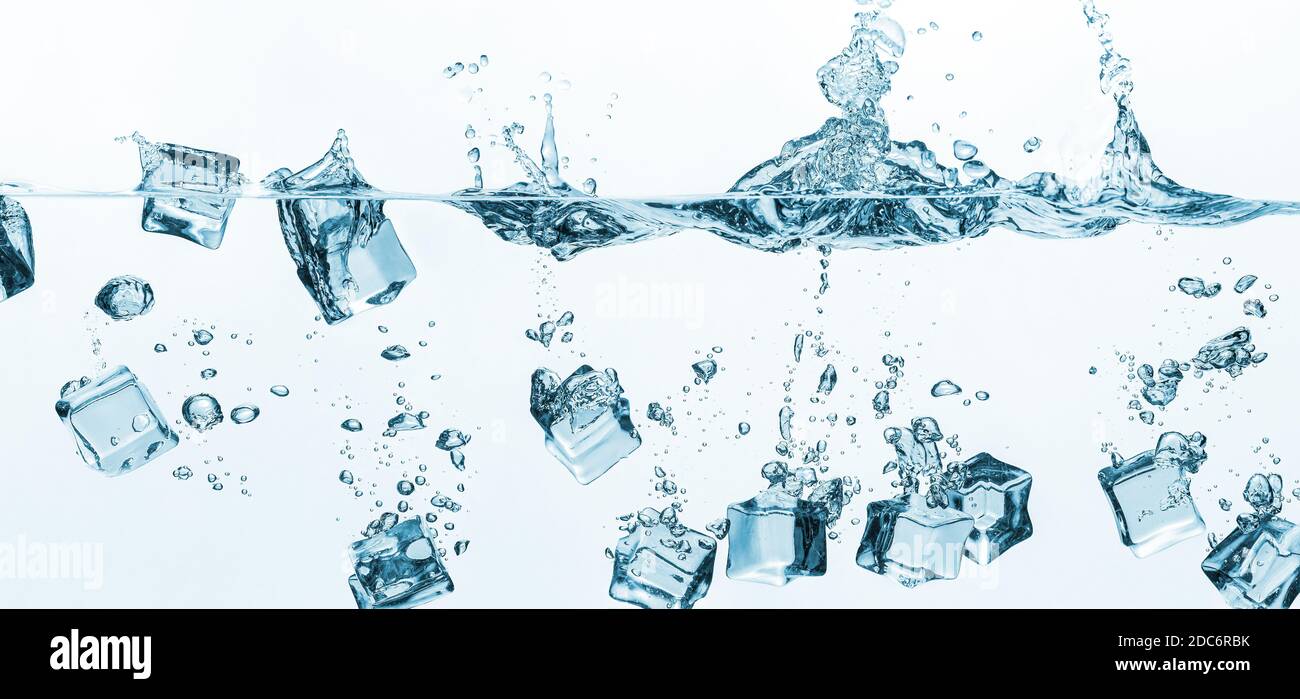 Falling ice cubes in water splashes isolated on white background. Ice ...