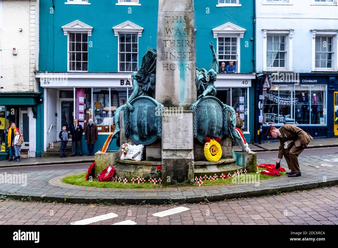 A Young Soldier In Military Uniform Lays A Wreath At The War Memorial ...