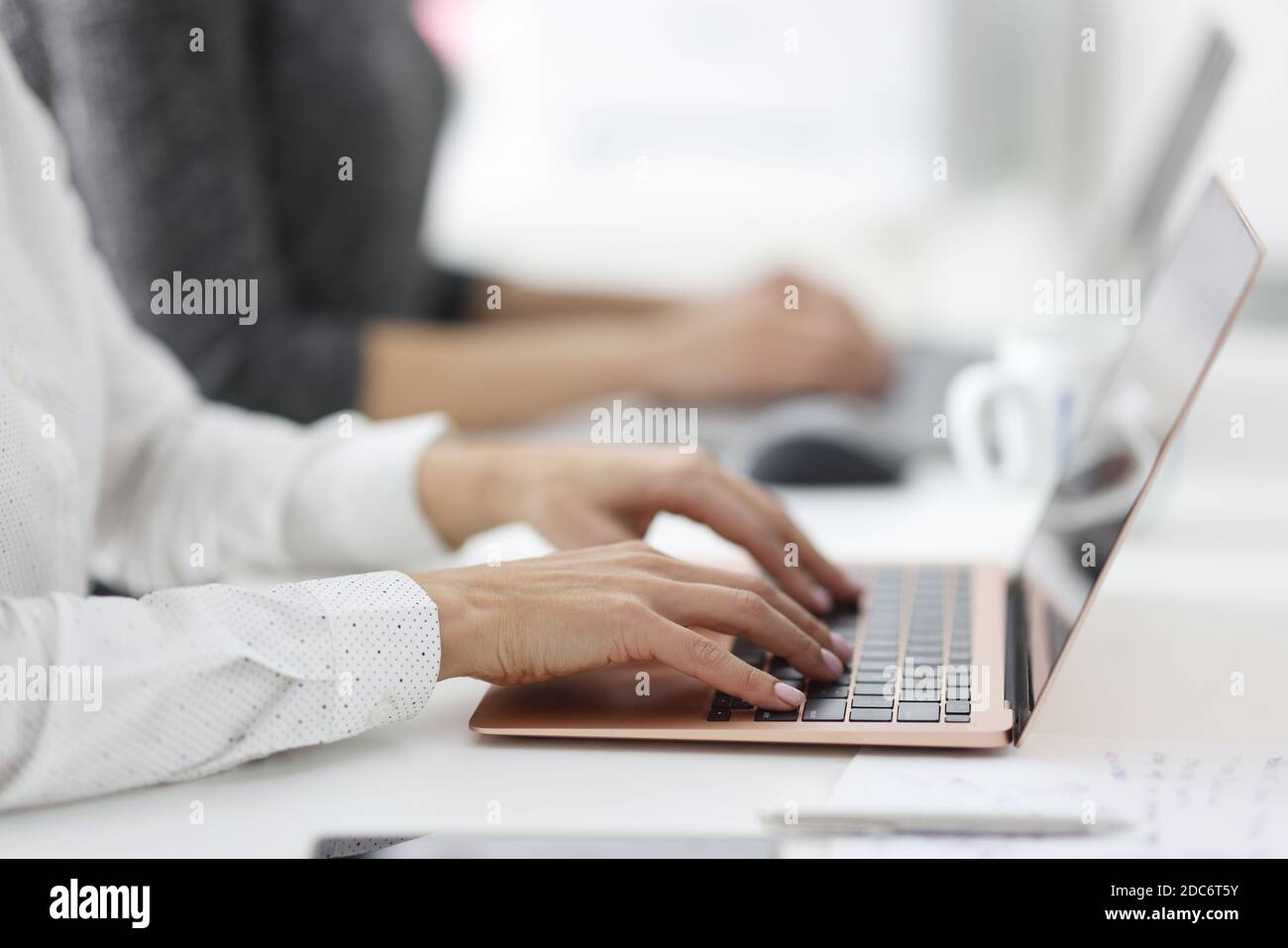 Laptops on desk office hands hi-res stock photography and images - Alamy
