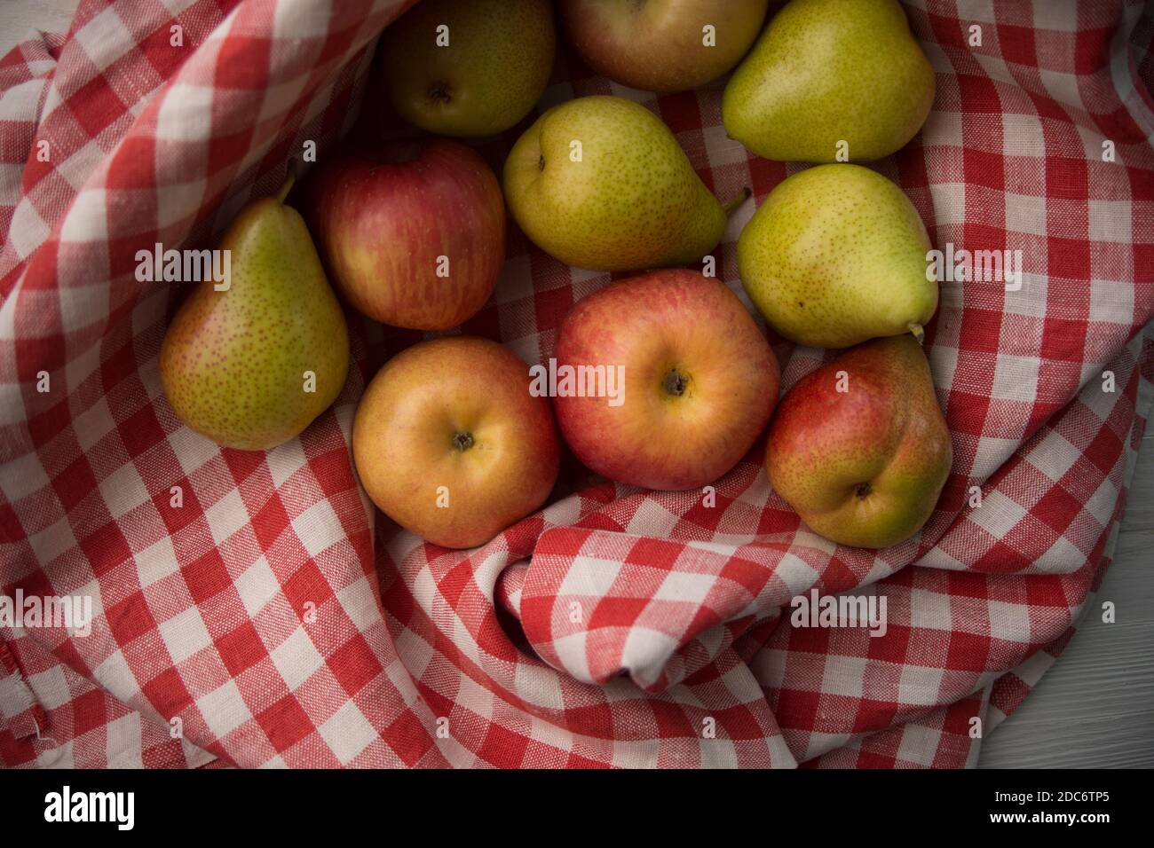 apples on a checkered fabric Stock Photo - Alamy