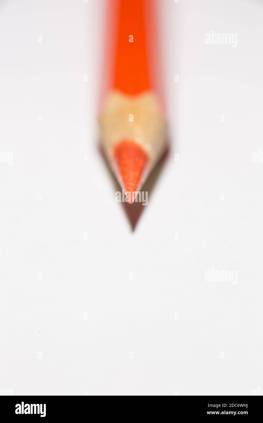 Extreme close upof red pencil on white background Stock Photo - Alamy