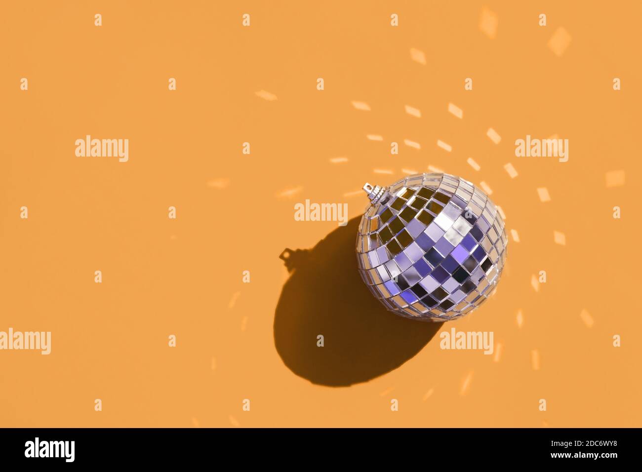 Christmas minimal festive background with christmas tree toy disco ball ...