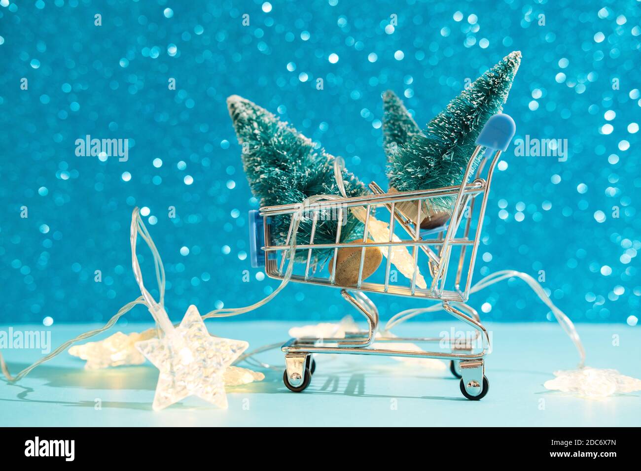 Christmas minimal festive background with star garland in supermarket ...