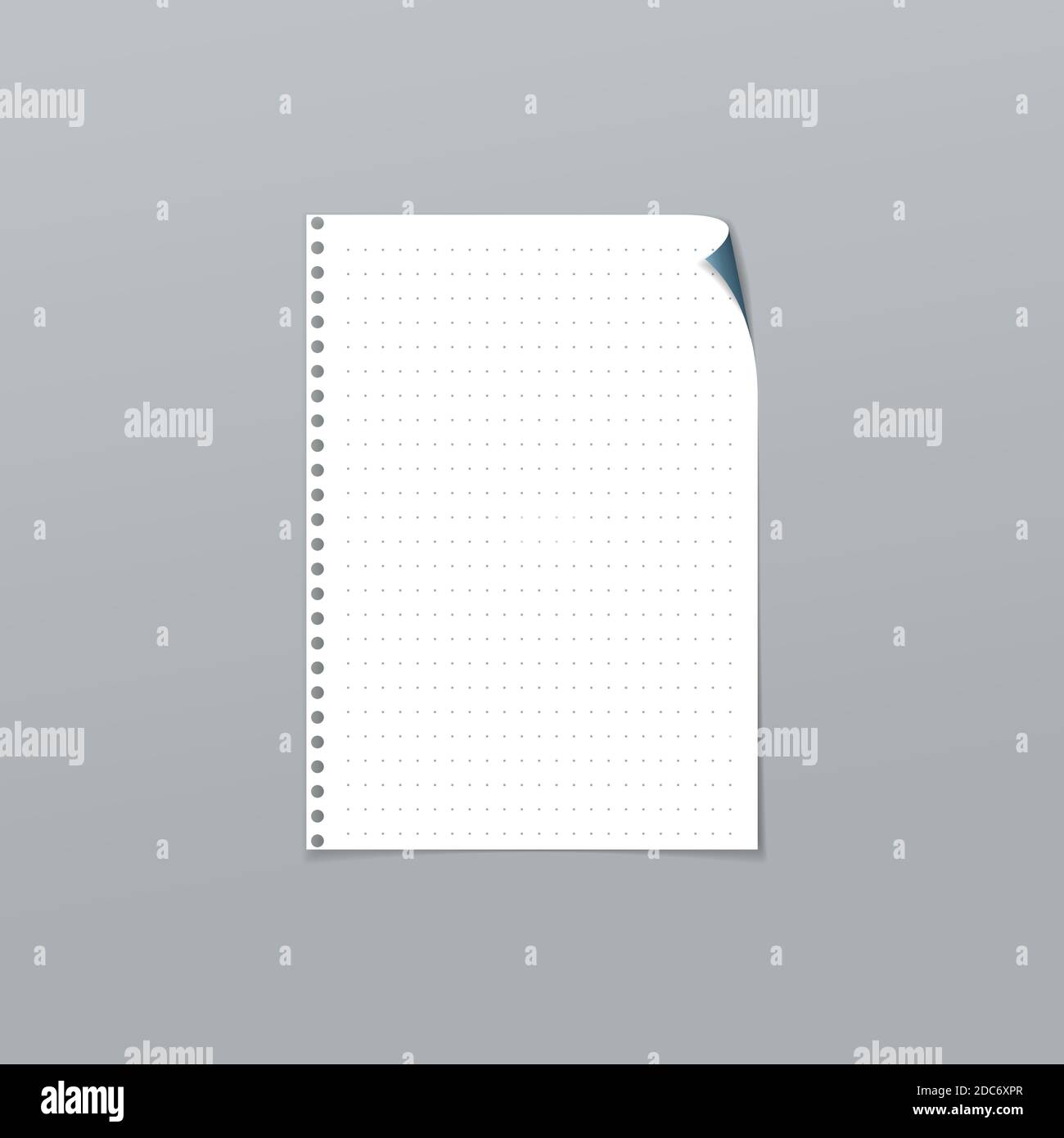 White dotted, lined note, notebook paper with folded corner is on grey ...