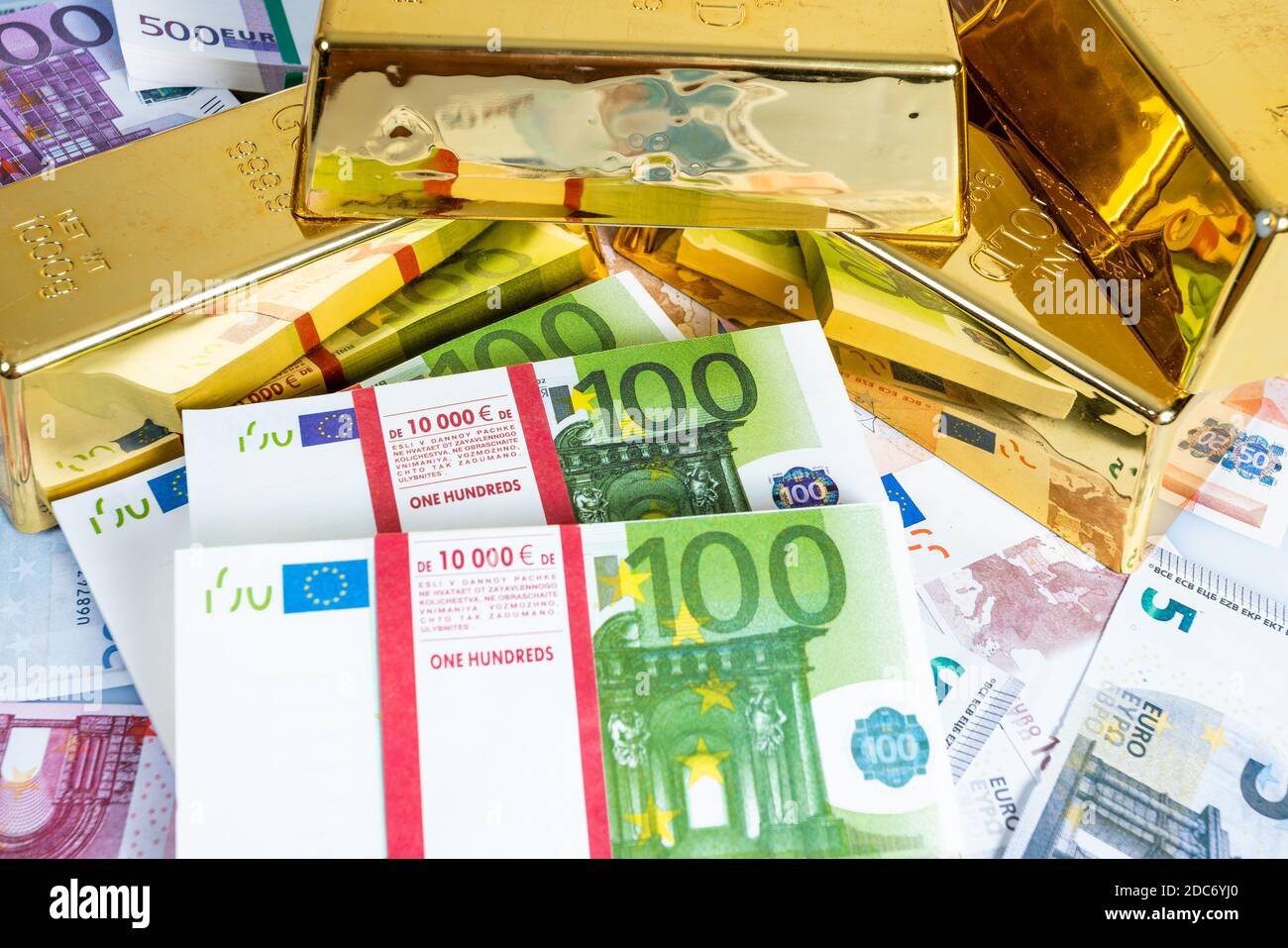 Gold Bullion with euro banknote background Stock Photo - Alamy