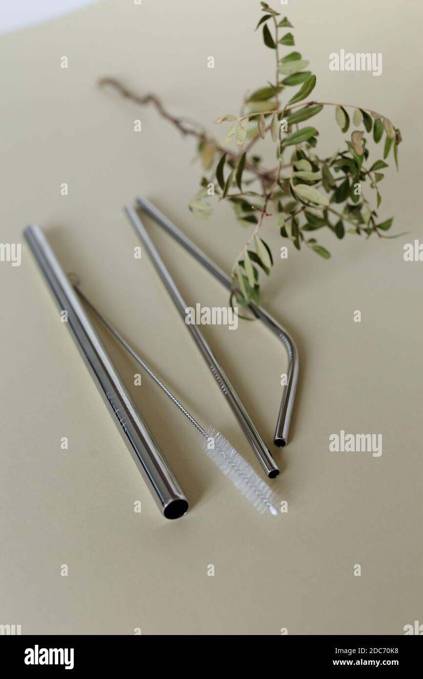 Stainless three steel straws in gray background near twig Stock Photo ...