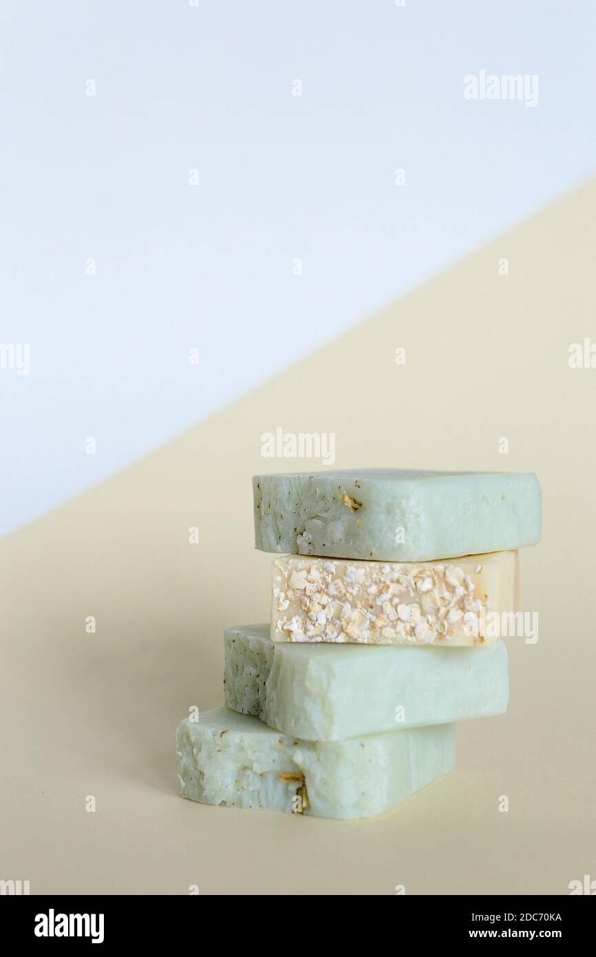 Bars of organic natural homemade soap in light background with copy ...