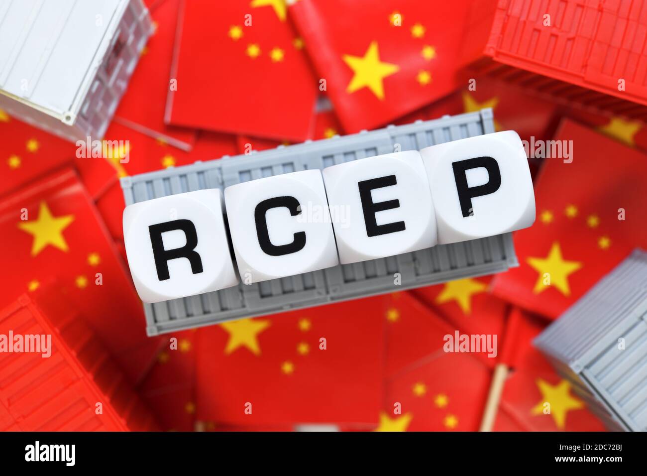 Letter cubes forming RCEP on container and flags of the People's ...