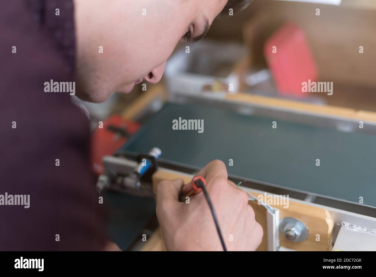 Scientists engineers designing small human robot, setting artificial ...