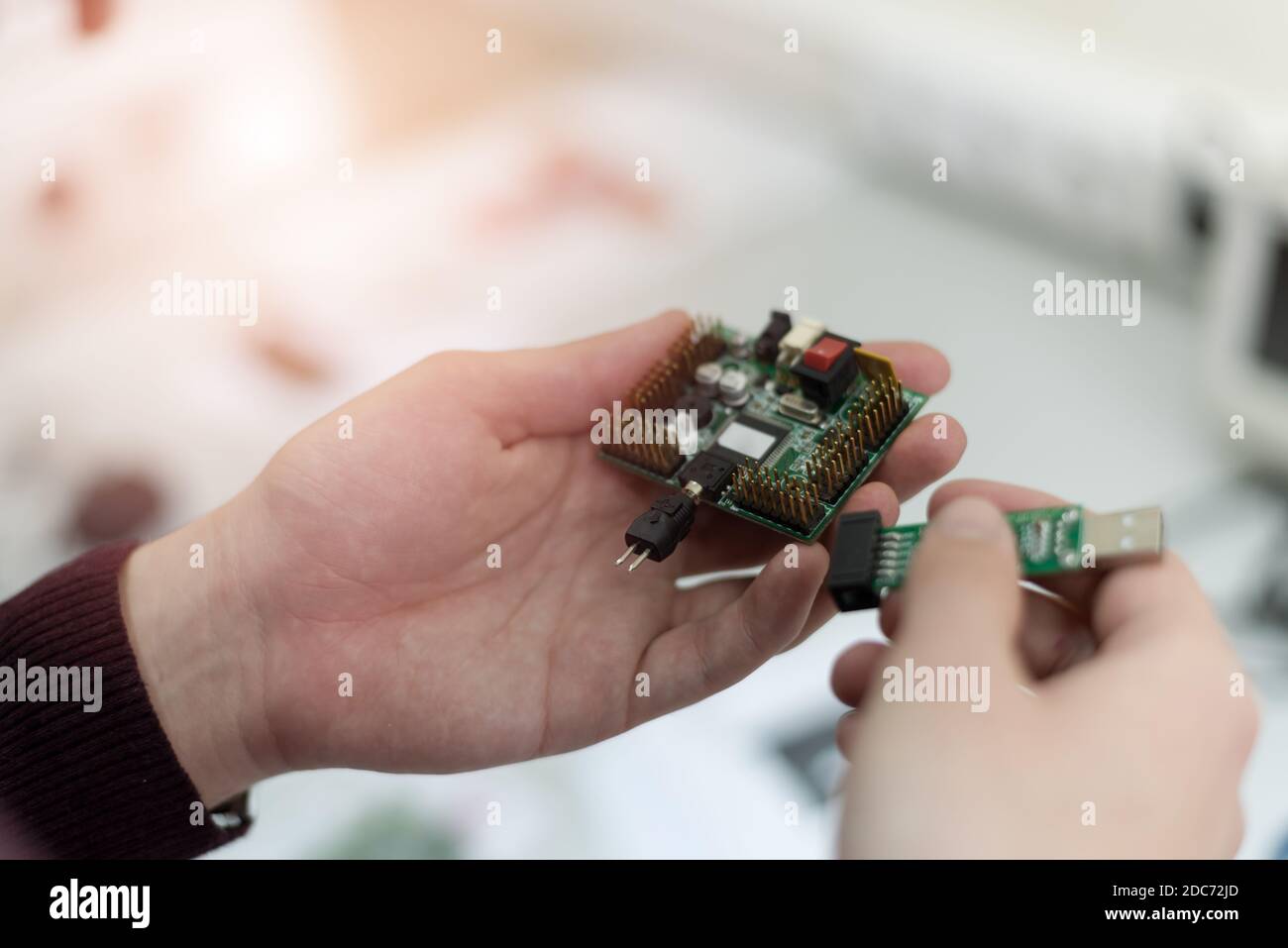 Scientists engineers designing small human robot, setting artificial intelligence humanoid robot ...