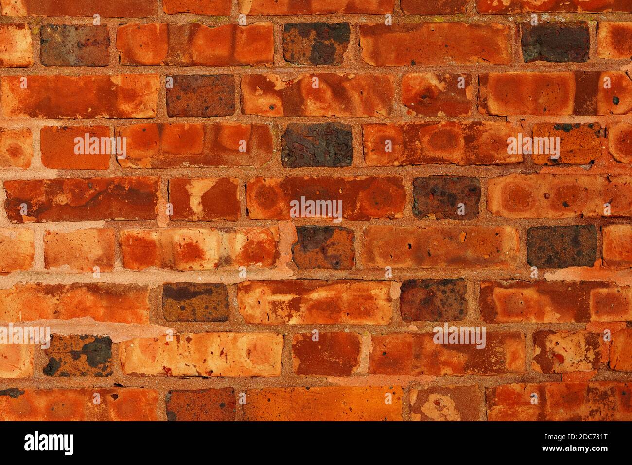 Red and orange brick wall background Stock Photo - Alamy