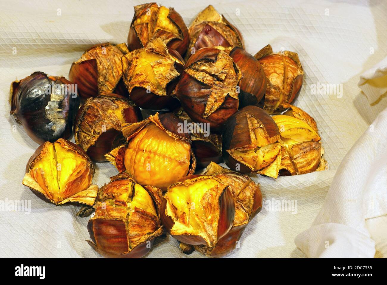 Roasted fresh chestnuts in a tea towel Stock Photo - Alamy