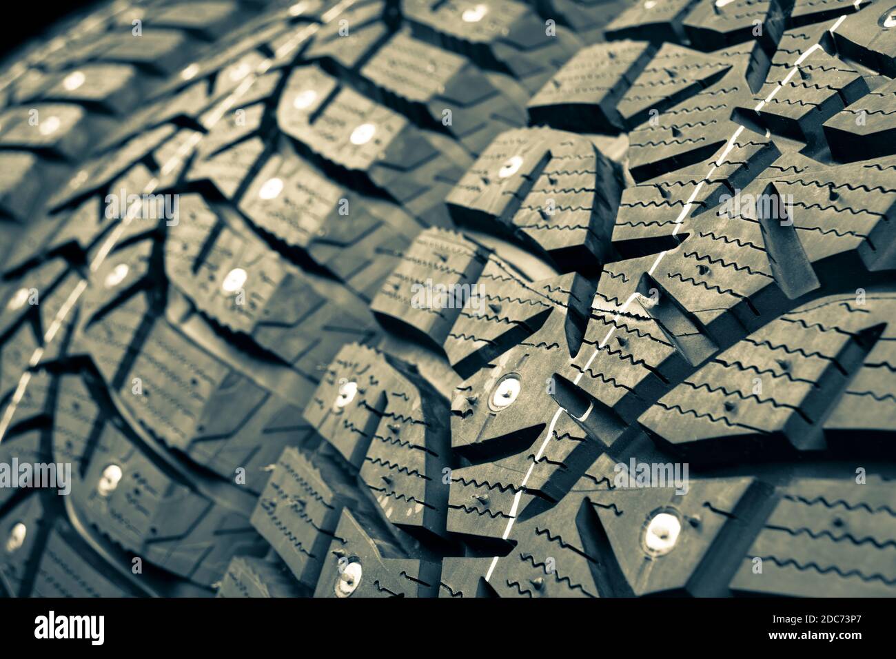 Winter studded tire. Winter car tires isolated on black background ...