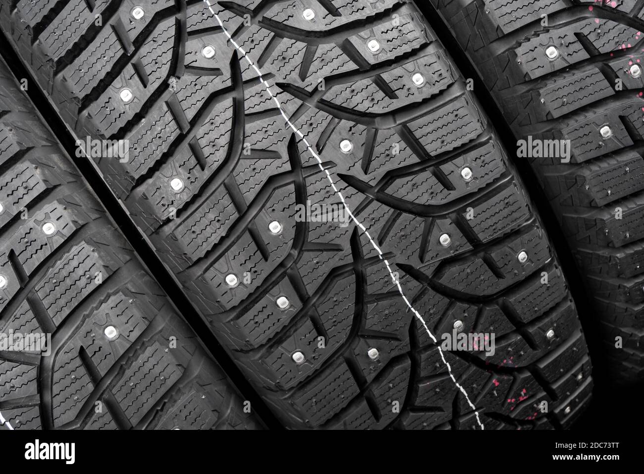 Winter studded tire. Winter car tires background. Tire stack background ...