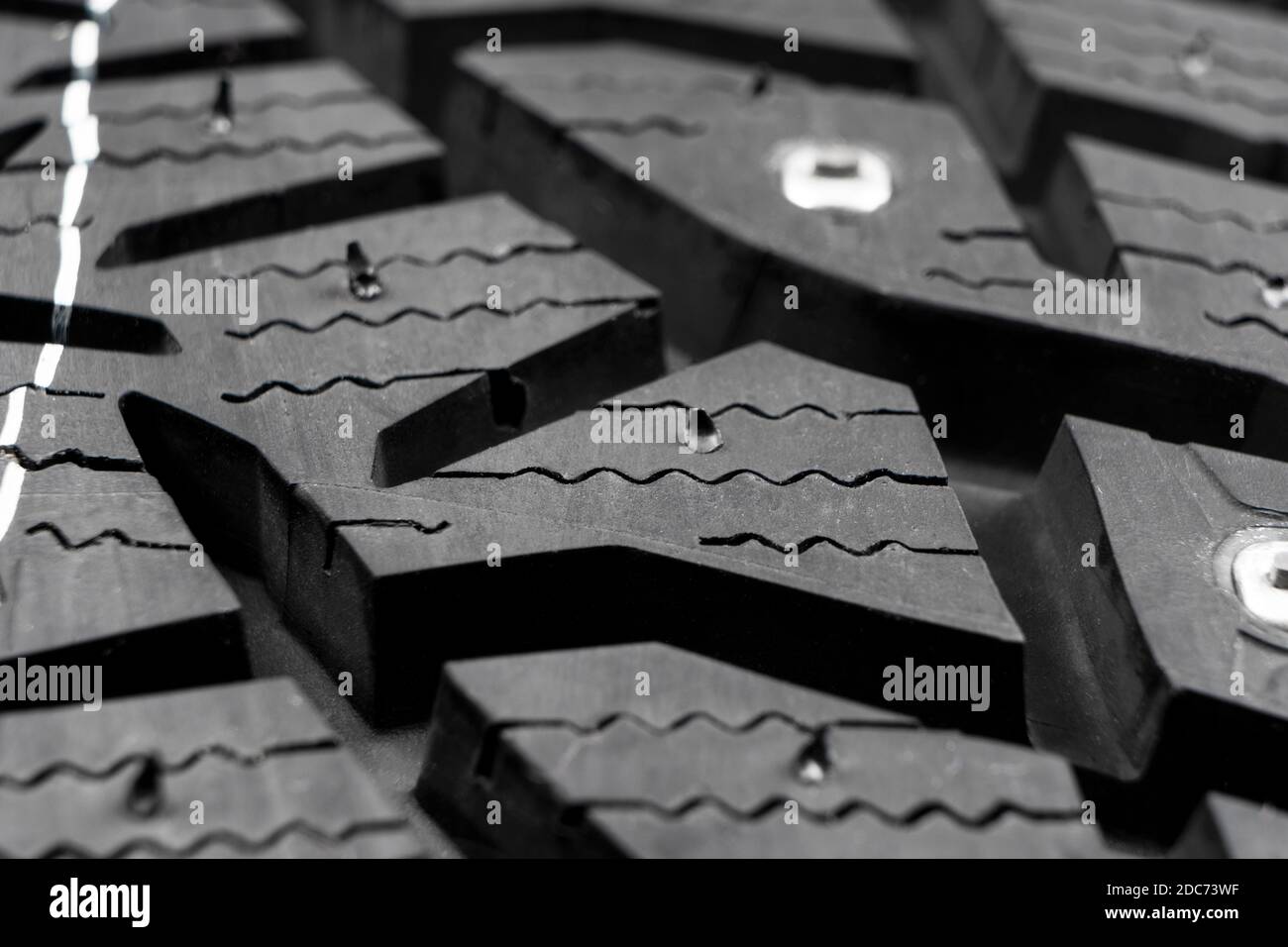 Macro shot winter studded tire. Winter car tires texture. Tyre ...