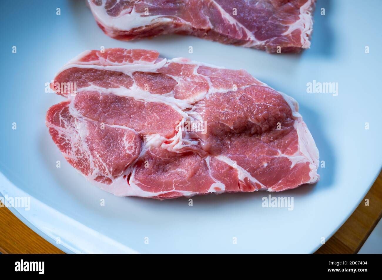 fresh neck steaks of pork with beautiful meat grain Stock Photo - Alamy