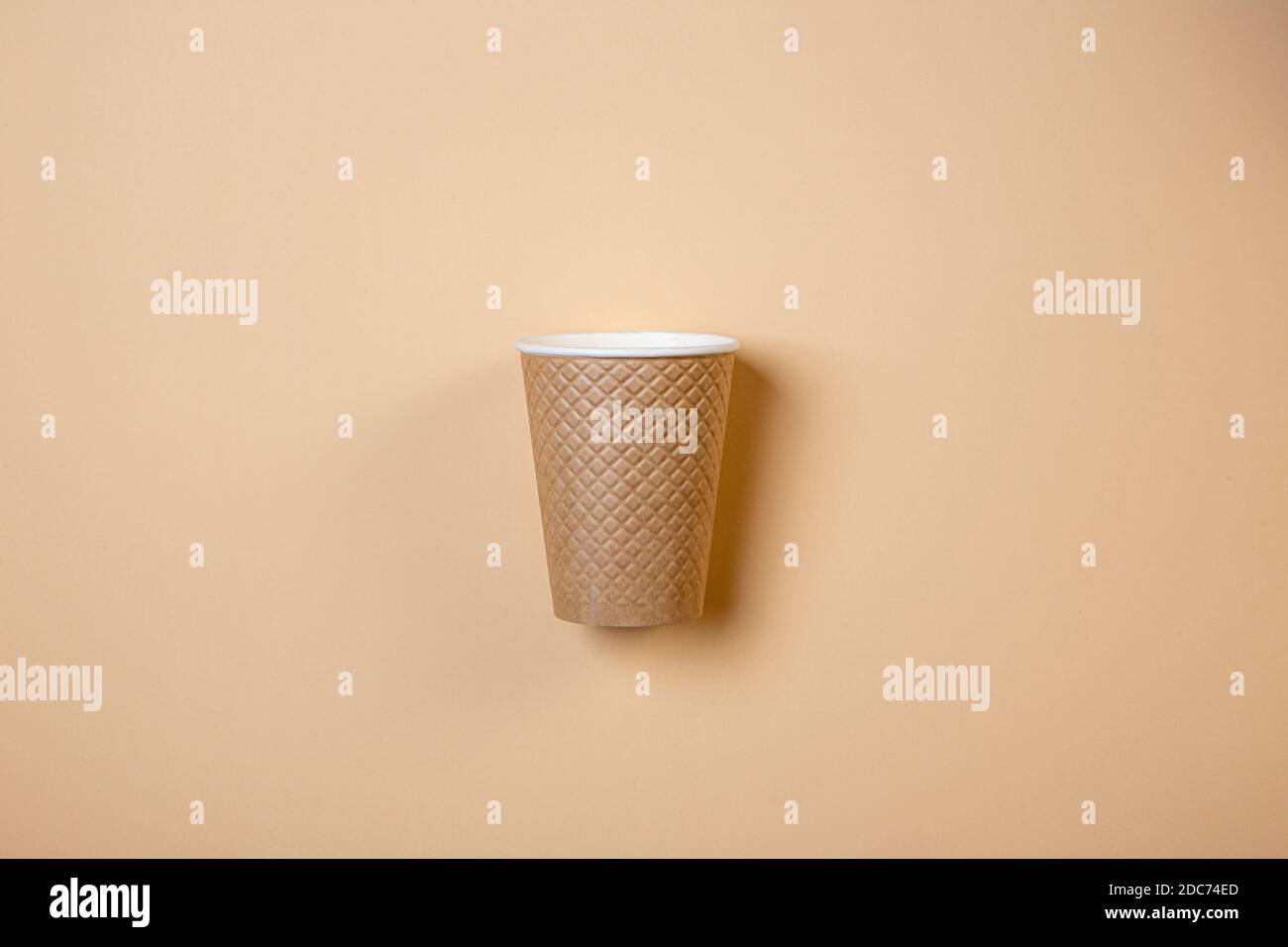 textured paper cup on a cream background Stock Photo - Alamy