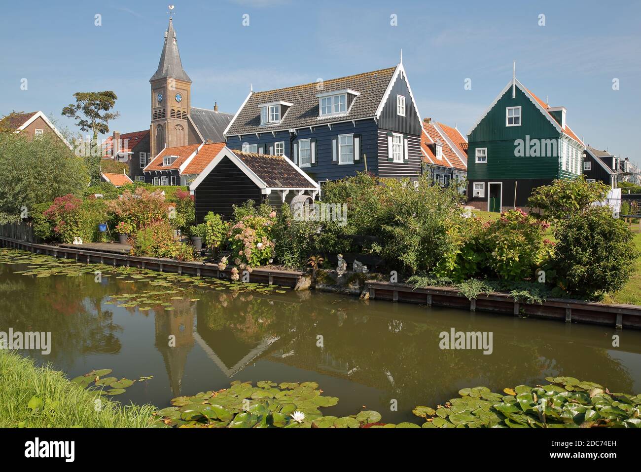Marken, a fishing village with traditional wooden houses and the church ...
